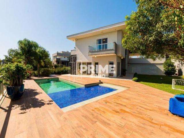 CASA EM CONDOMÍNIO 4 SUÍTES PISCINA JARDIM AMPLO PRÓXIMO AO PASSAÚNA