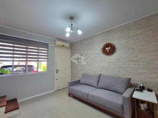 Casa em condomínio com 3 dormitórios e 1 vaga de garagem, no bairro Humaitá, em