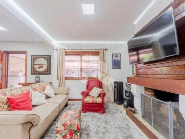 Casa em condomínio com 3 dormitórios e 3 vagas no bairro Santa Tereza