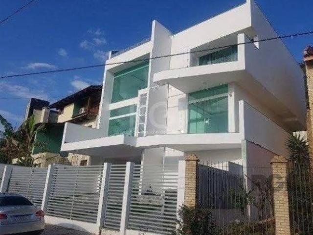 Casa em condomínio com 3 dormitórios, sendo 1 suíte, cozinha americana, banheiro, living para dois a