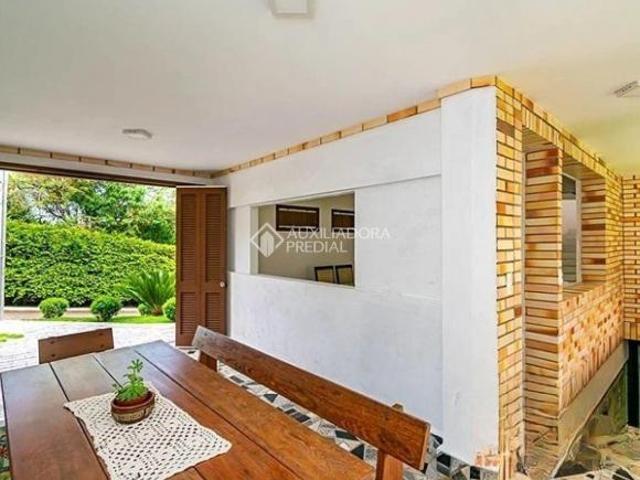 Casa em condomínio com 3 suítes garagem 67 mts livre terraço com piscina no bairro Nonoai