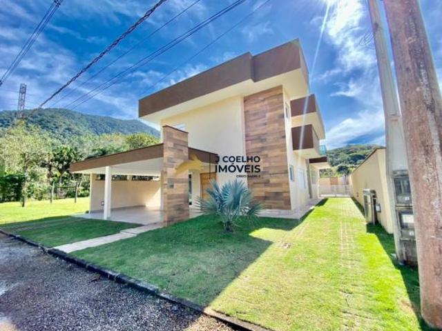 Casa em condomínio com 4 suítes, piscina e sauna na Praia da Lagoinha SP