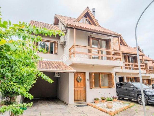 Casa em condomínio com 3 dormitórios no bairro Guarujá