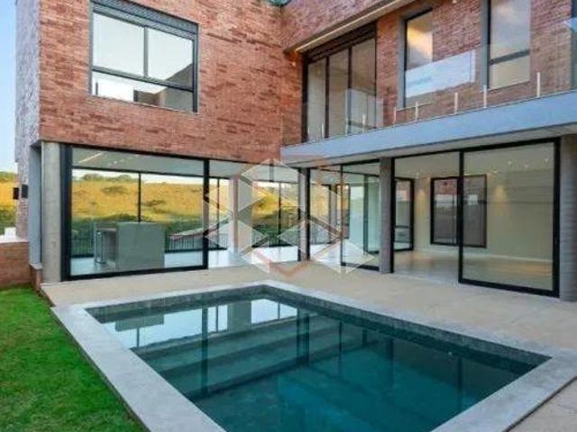 Casa em Condomínio à Venda com 484 m² 4 suítes, 6 vagas Condomínio Alphaville3