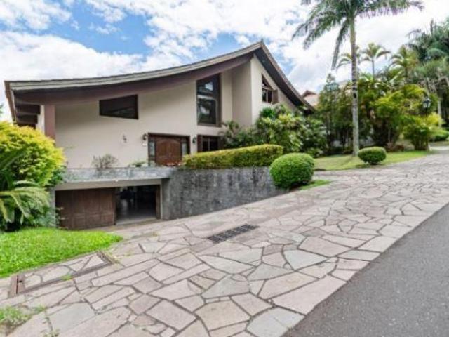 Casa em Condomínio à venda com 5 dormitórios, 565m² e 4 vagas no Condominio Jardim do Sol, Zona Sul