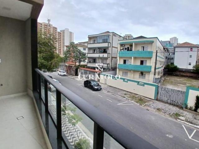 Casa em condomínio à venda na Praia Grande com 71 m², 2 suítes e varanda