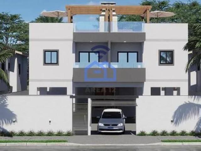Casa em condomínio à venda no bairro Massaguaçu em Caraguatatuba, SP à 450 metros da praia com 2 suí