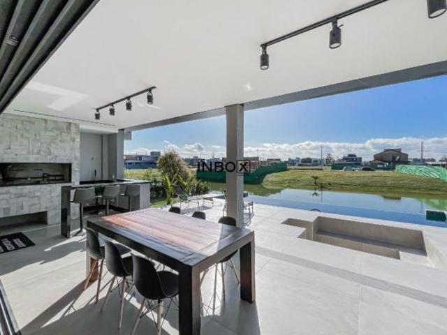 Casa em condomínio à venda no Ponta da Figueira, com 344 m² privativos, 4 suítes, 4 vagas, mobiliada