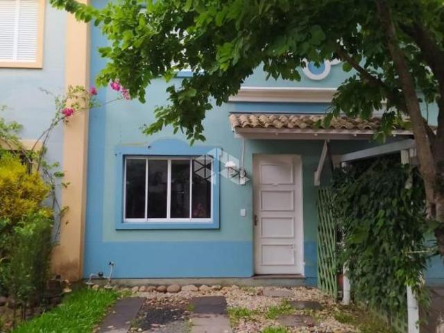 Casa em condomínio fechado, 3 dormitórios sendo 1 suíte americana,com Vaga de Garagem no Bairro Huma