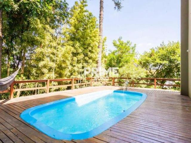 Casa em condomínio fechado com piscina à venda próximo ao Parque Bacacheri