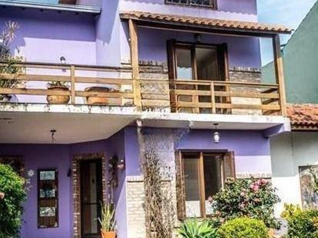 Casa em condomínio fechado de 2 quartos, suíte, 2 vagas no bairro Guarujá