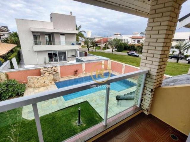 casa em condomínio frente mar com vista parcial mar