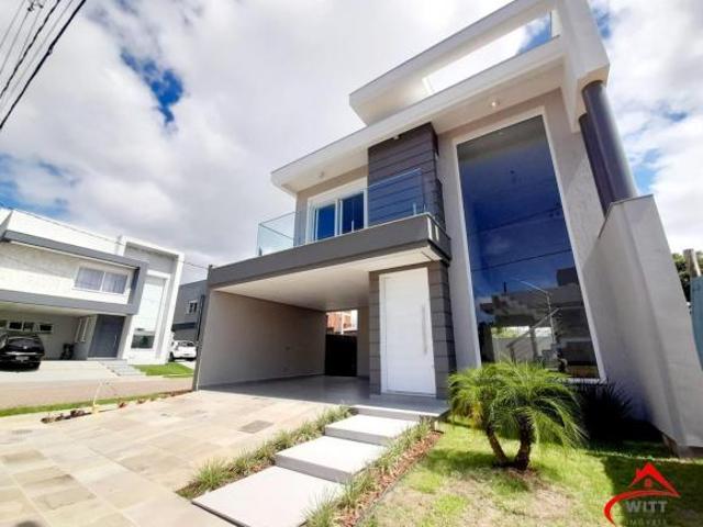 Casa em condomínio Las Brisas, 3 suítes e 2 vagas de garagem em Canoas