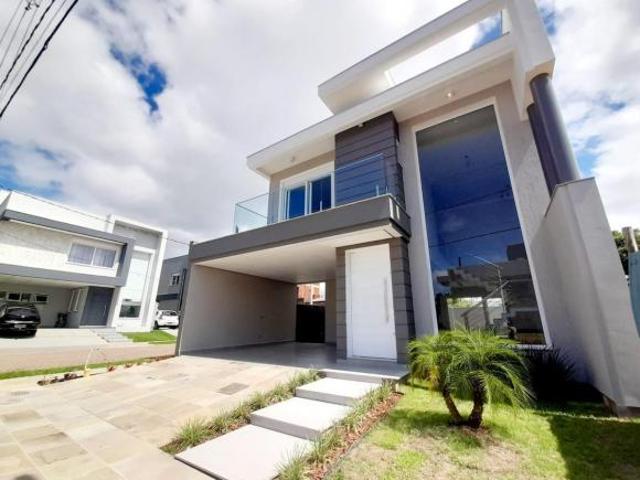 Casa em condomínio Las Brisas, 3 suítes e 2 vagas de garagem em Canoas