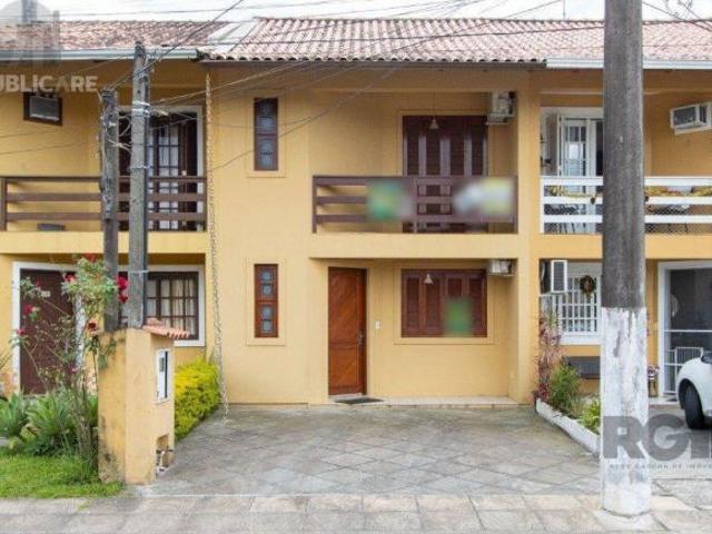 Casa em Condomínio na Zona Sul, no bairro Hípica, com 2 dormitórios, living para