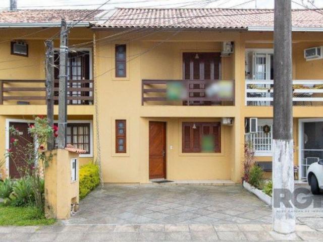 Casa em Condomínio na Zona Sul, no bairro Hípica, com 2 dormitórios, living para dois ambientes, coz