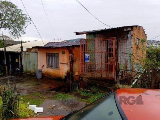 Casa em Porto Alegre, no bairro Cavalhada, com 3 dormitório s, à venda