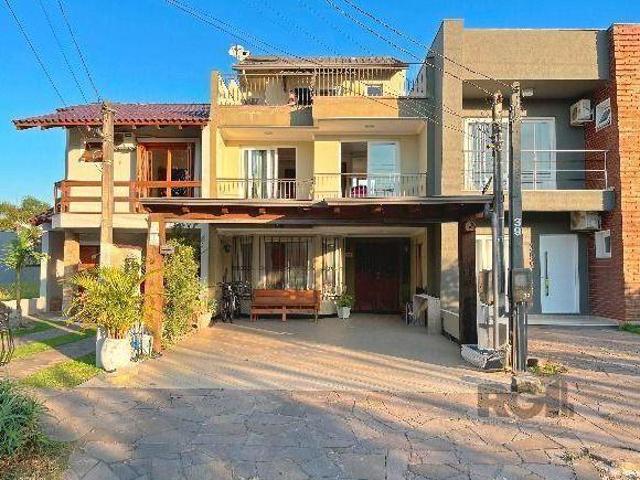 Casa em Porto Alegre, no bairro Hípica, com 3 dormitório s, e 3 banheiros, à venda