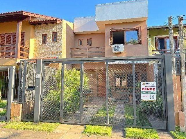 Casa em Porto Alegre, no bairro Hípica, com 3 dormitório s, e 3 banheiros, à venda