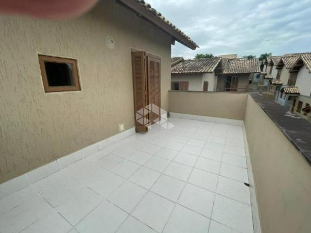 Casa estilo sobrado, em condomínio fechado, com 3 dormitórios, sendo 1 suíte, com terraço e vista pa