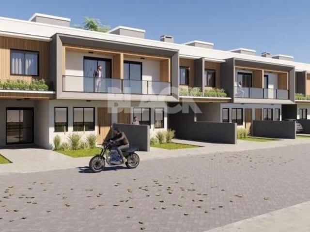 Casa geminada nova com 2 suítes Torres RS