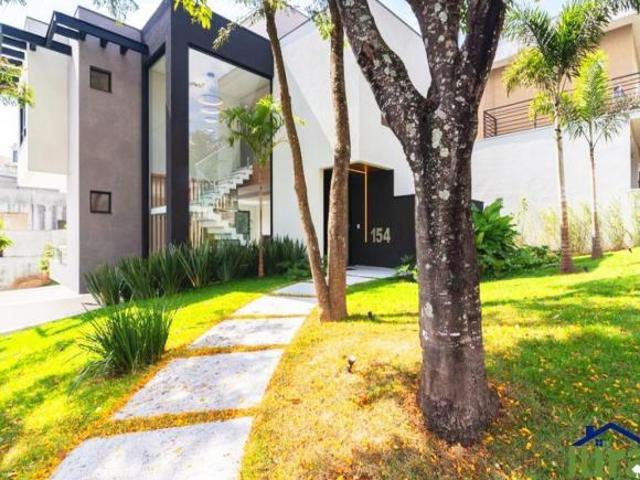 Casa para venda com 4 suítes, 4 vagas de garagem e piscina no condomínio New Ville, Santana de Parna