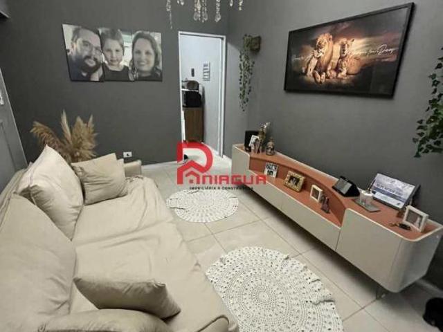 Casa para venda em Canto Do Forte de 103.00m² com 2 Quartos, 1 Suite e 2 Garagens