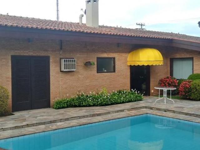 Casa para venda em Centro de 439.00m² com 5 Quartos e 3 Garagens