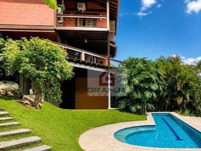 Casa rústica contemporânea à venda na Granja Viana com vista para área verde, 1.323 m² de terreno e