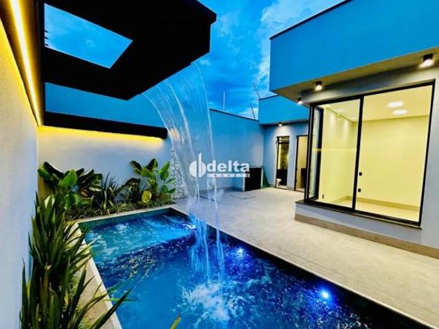 Casa residencial com 3 suítes disponível para venda no bairro Grand Ville em Uberlândia MG