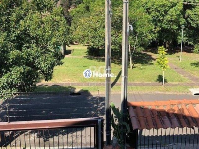 Casa residencial de 3 dormitórios sendo um uma suíte localizada no bairro Guaruj