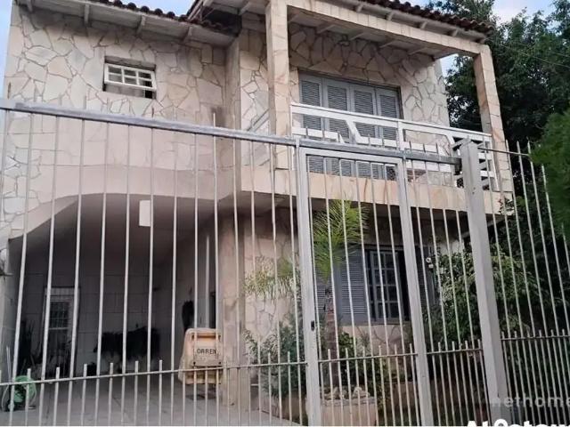 Casa / Sobrado para Venda em Alvorada/RS Jardim Algarve 3 Quartos