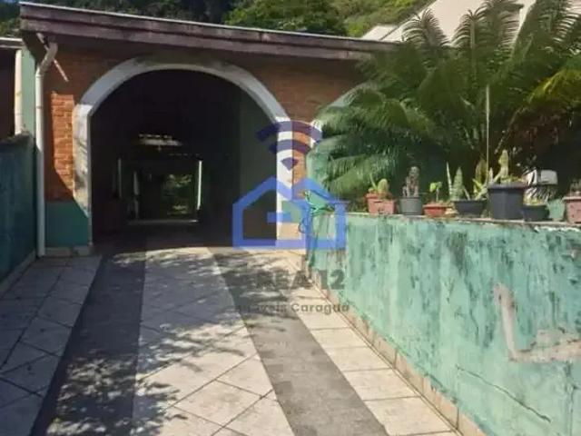 Casa / Sobrado para Venda em Caraguatatuba/SP Martim de Sá 4 Quartos