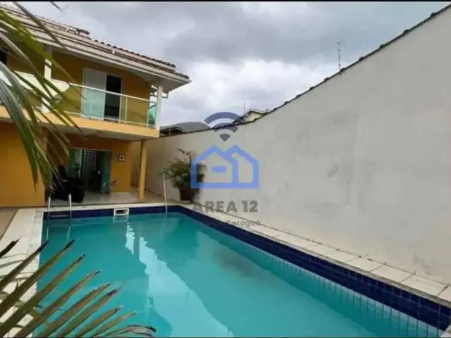 Casa / Sobrado para Venda em Caraguatatuba/SP Martim de Sá 4 Quartos