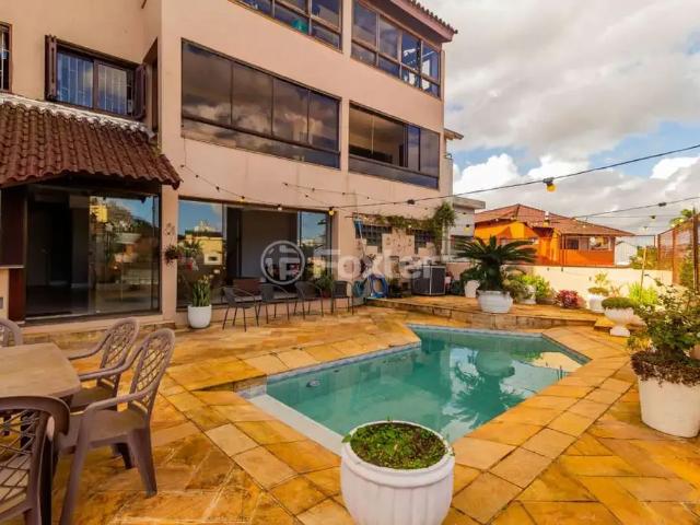 Casa / Sobrado para Venda em Porto Alegre/RS Três Figueiras 4 Quartos