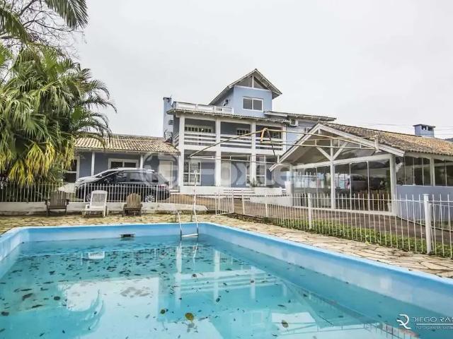 Casa / Sobrado para Venda em Porto Alegre/RS Vila Nova 4 Quartos