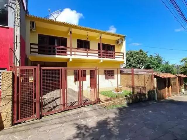 Casa / Sobrado para Venda em Porto Alegre/RS Vila Nova 4 Quartos