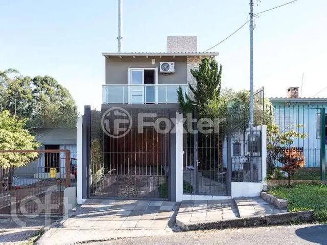 Casa / Sobrado para Venda em Porto Alegre/RS Vila Nova 4 Quartos