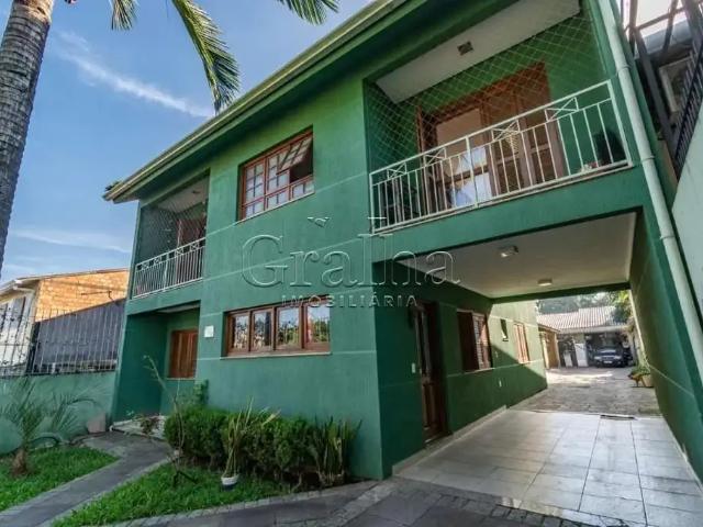Casa / Sobrado para Venda em Porto Alegre/RS Vila Jardim 4 Quartos