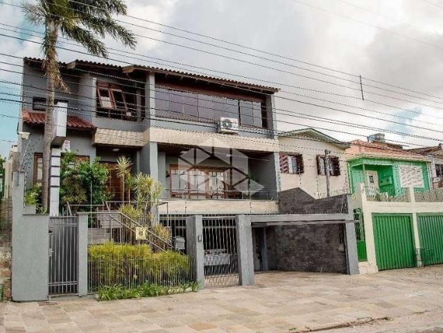 Casa / Sobrado para Venda em Porto Alegre/RS Vila Jardim 5 Quartos