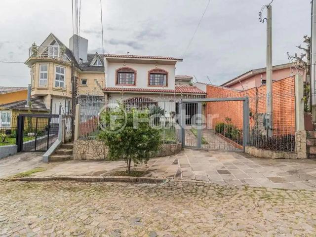 Casa / Sobrado para Venda em Porto Alegre/RS Cavalhada 4 Quartos