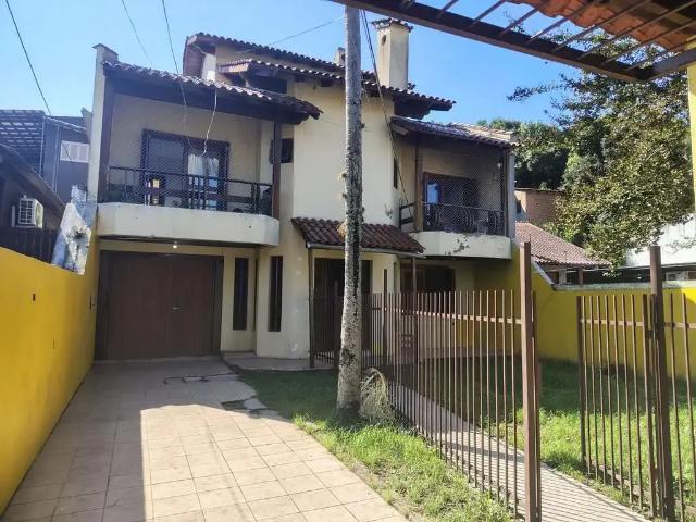 Casa / Sobrado para Venda em Porto Alegre/RS Cavalhada 4 Quartos