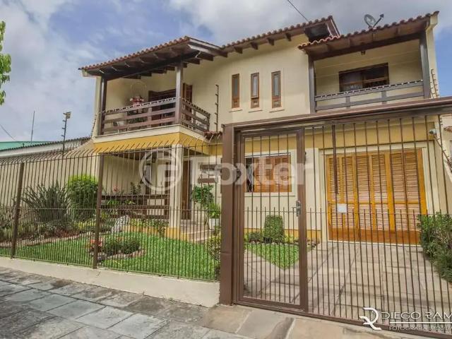 Casa / Sobrado para Venda em Porto Alegre/RS Cavalhada 4 Quartos