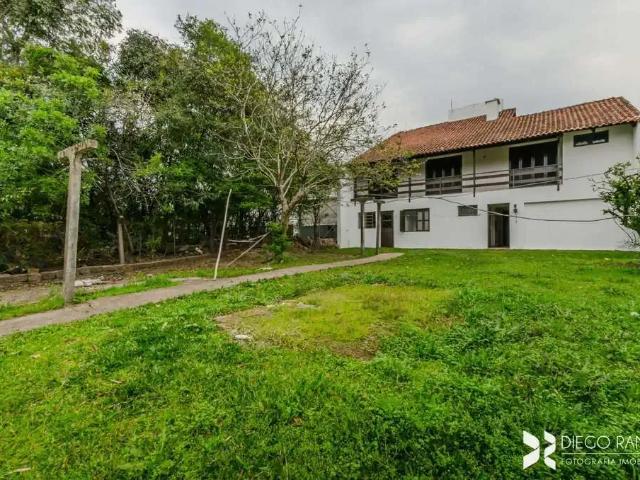 Casa / Sobrado para Venda em Porto Alegre/RS Cavalhada 4 Quartos
