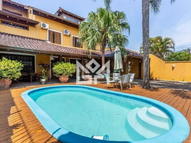 Casa / Sobrado para Venda em Porto Alegre/RS Guarujá 4 Quartos
