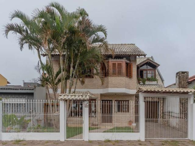 Casa / Sobrado para Venda em Porto Alegre/RS Guarujá 4 Quartos