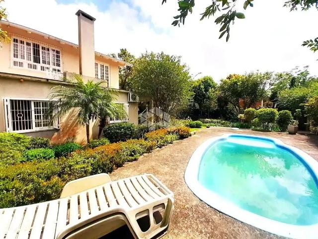 Casa / Sobrado para Venda em Porto Alegre/RS Lami 4 Quartos