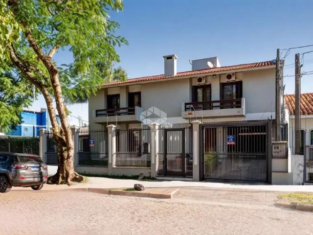 Casa / Sobrado para Venda em Porto Alegre/RS Partenon 4 Quartos