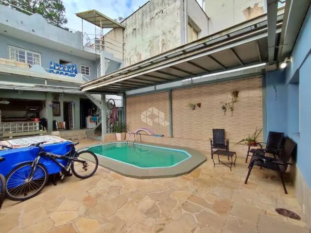 Casa / Sobrado para Venda em Porto Alegre/RS Partenon 4 Quartos
