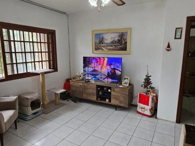 Casa Térrea à venda no bairro Tristeza, com 3 dormitórios e 4 vagas